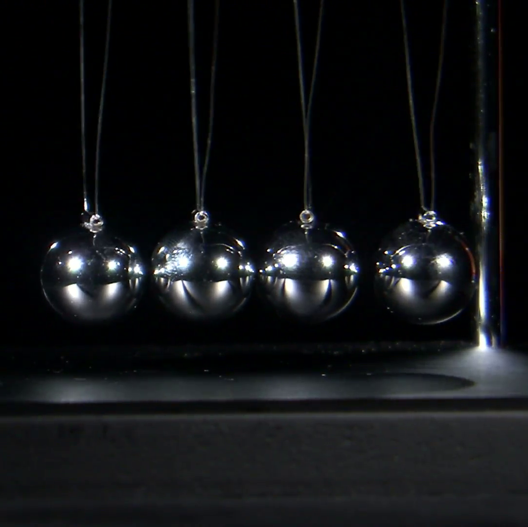 square newtons-cradle-balls-colliding-on-black-background_4ywntrnd ...